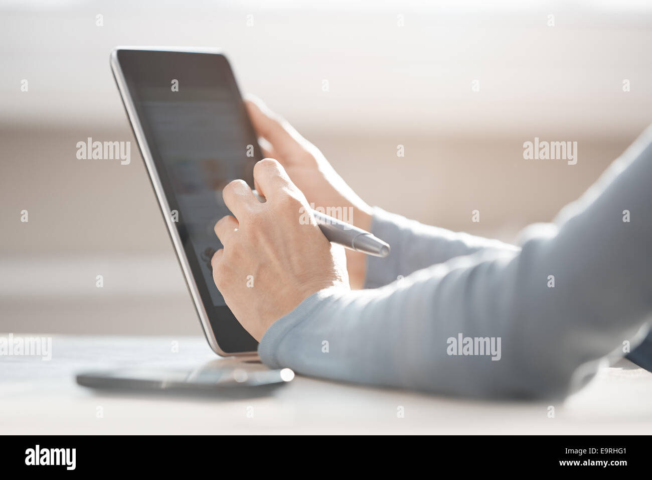 Human hands using tablet PC for Internet surfing Stock Photo - Alamy