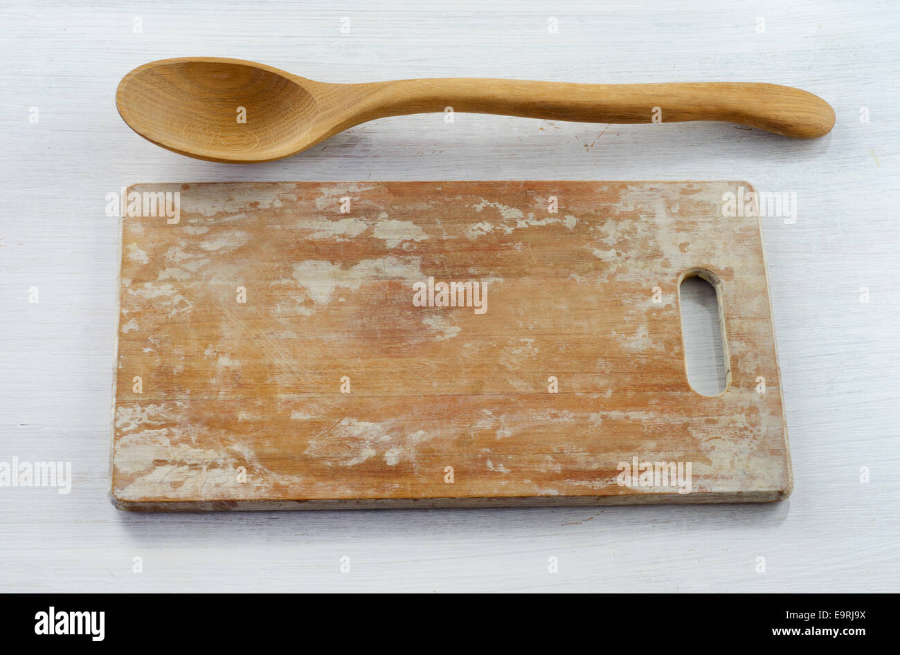 wooden spoon on cutting board Stock Photo - Alamy