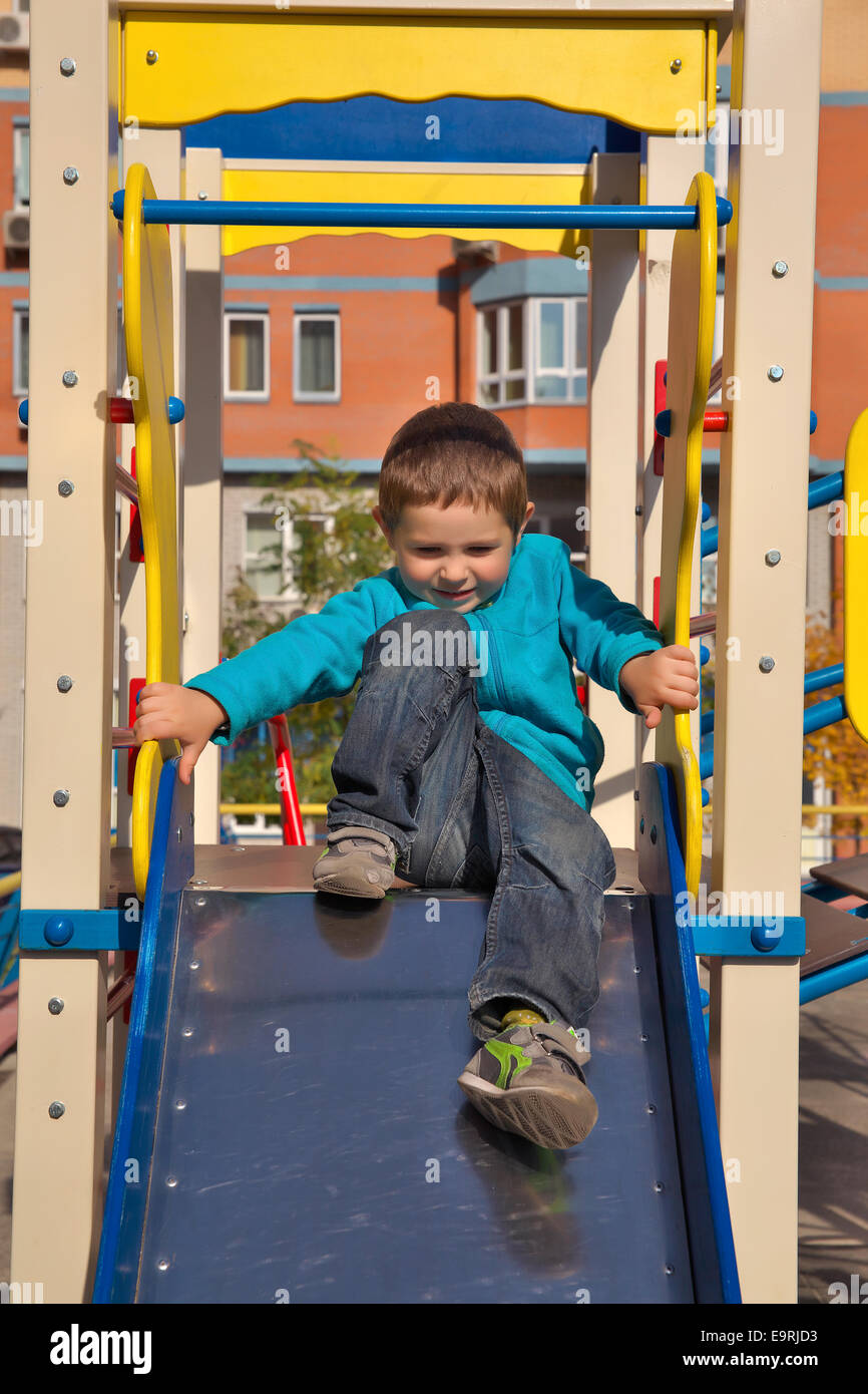 Little boy having fun on the playground Stock Photo - Alamy