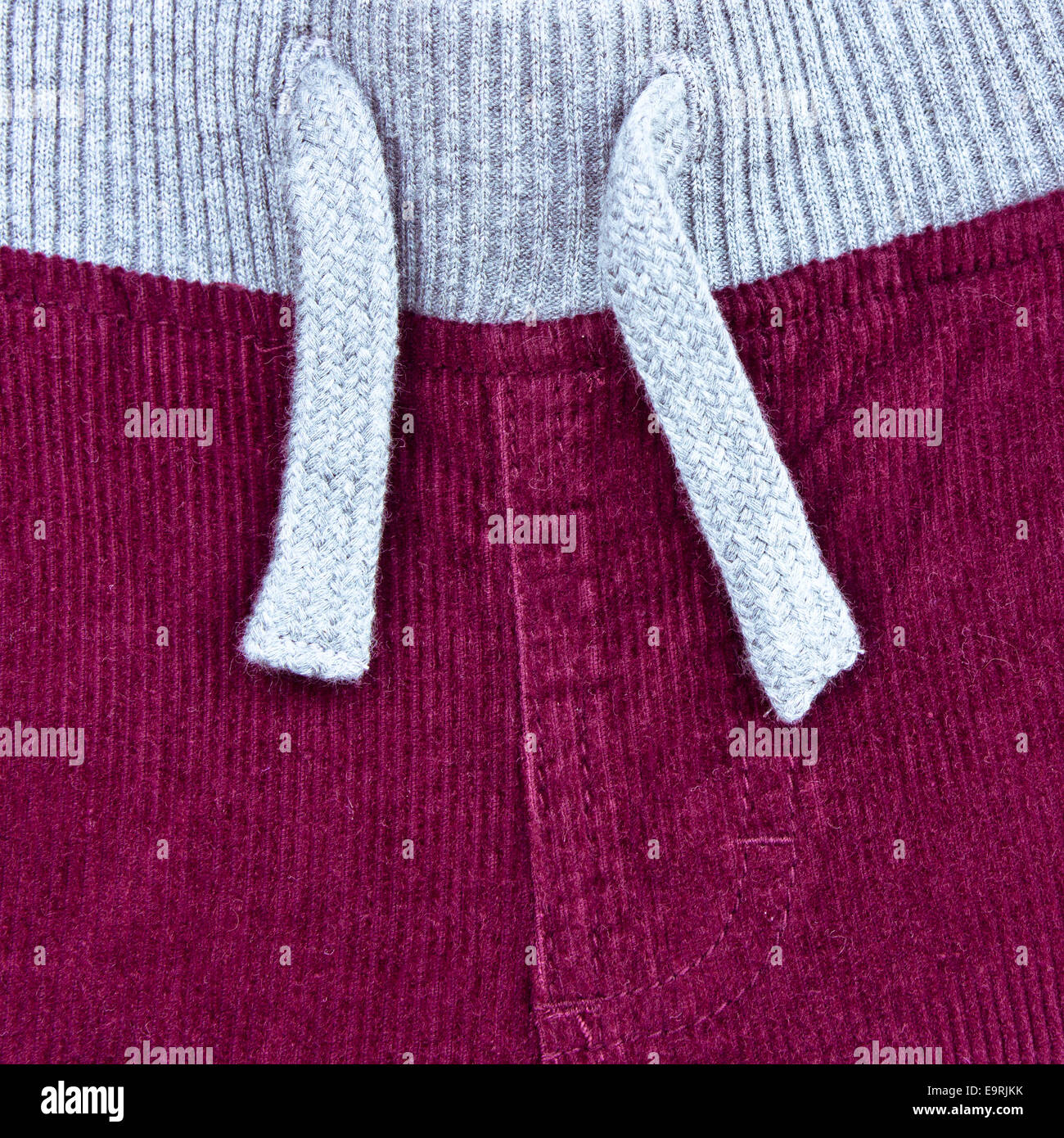 Drawstring on the waist of a pair of casual trousers Stock Photo - Alamy