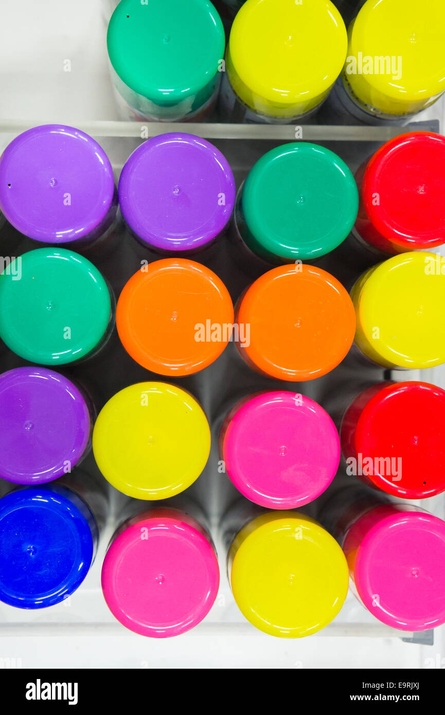 Colorful plastic spray can tops as a background Stock Photo - Alamy