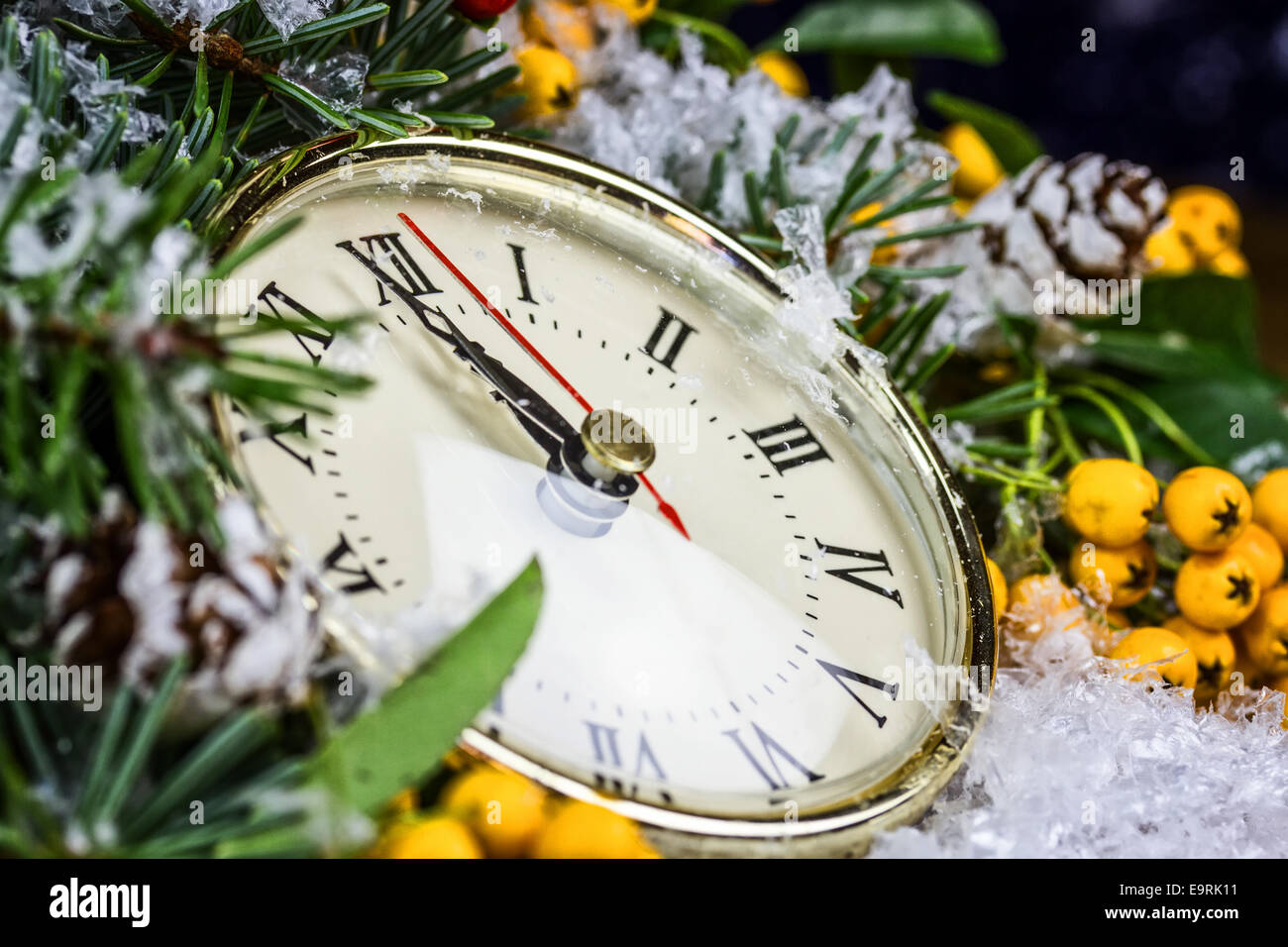 Christmas clock with winter decoration Stock Photo - Alamy