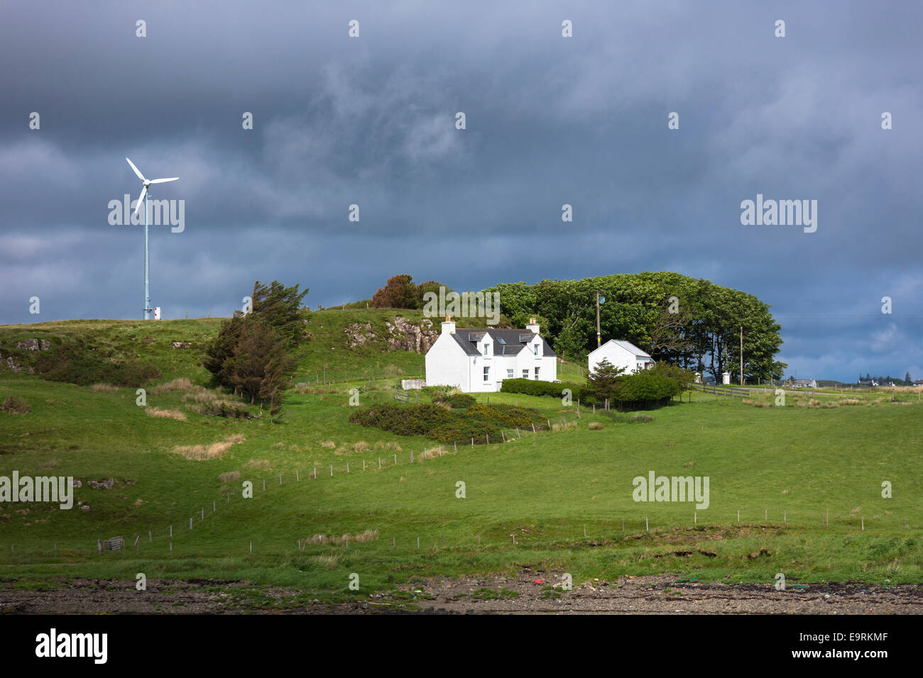 Whitewashed cottage powered by wind turbine near Harlosh on the Isle of ...