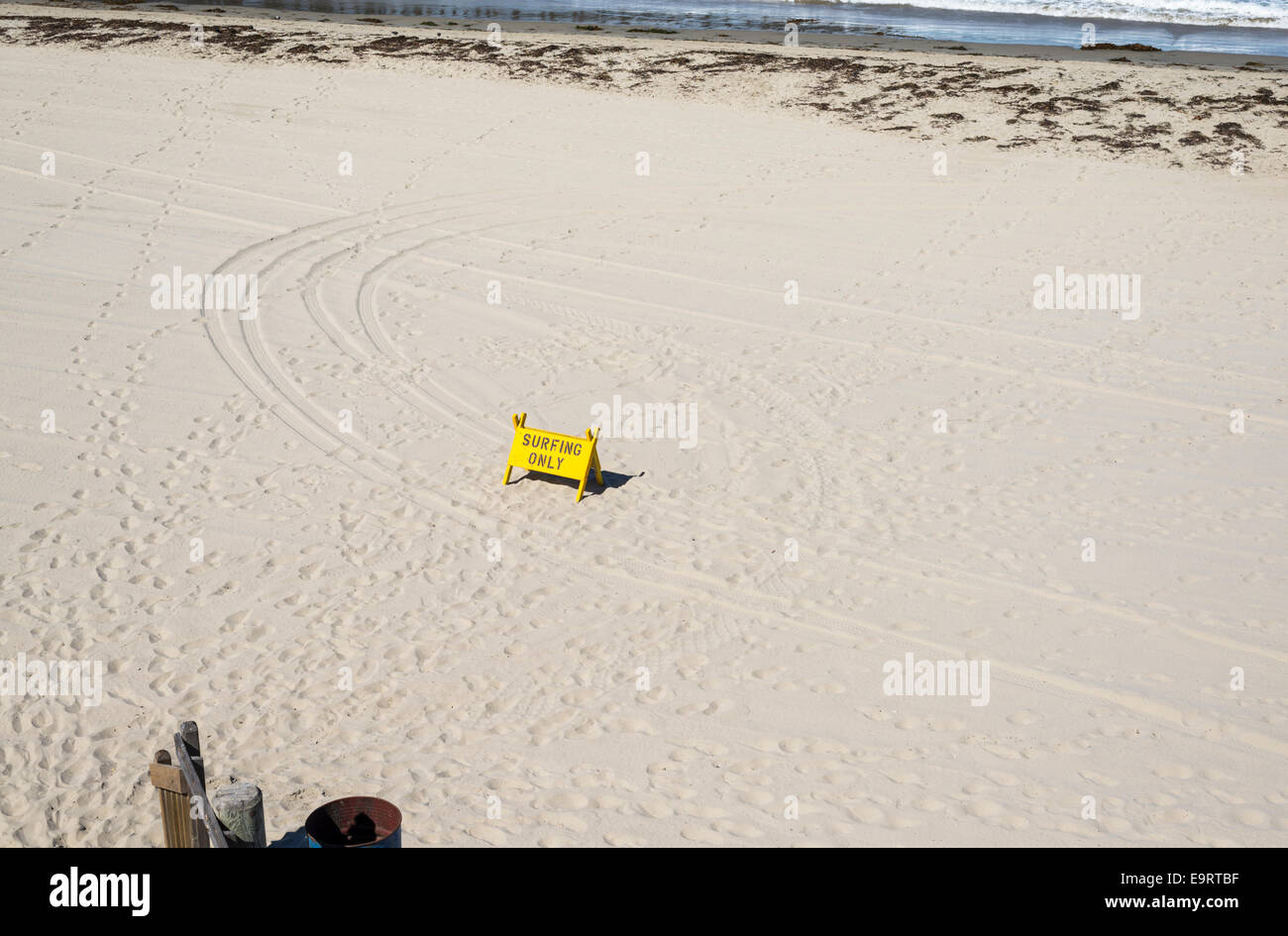 Looking down on a Surfing Only warning sign on Pacific Beach. San Diego ...