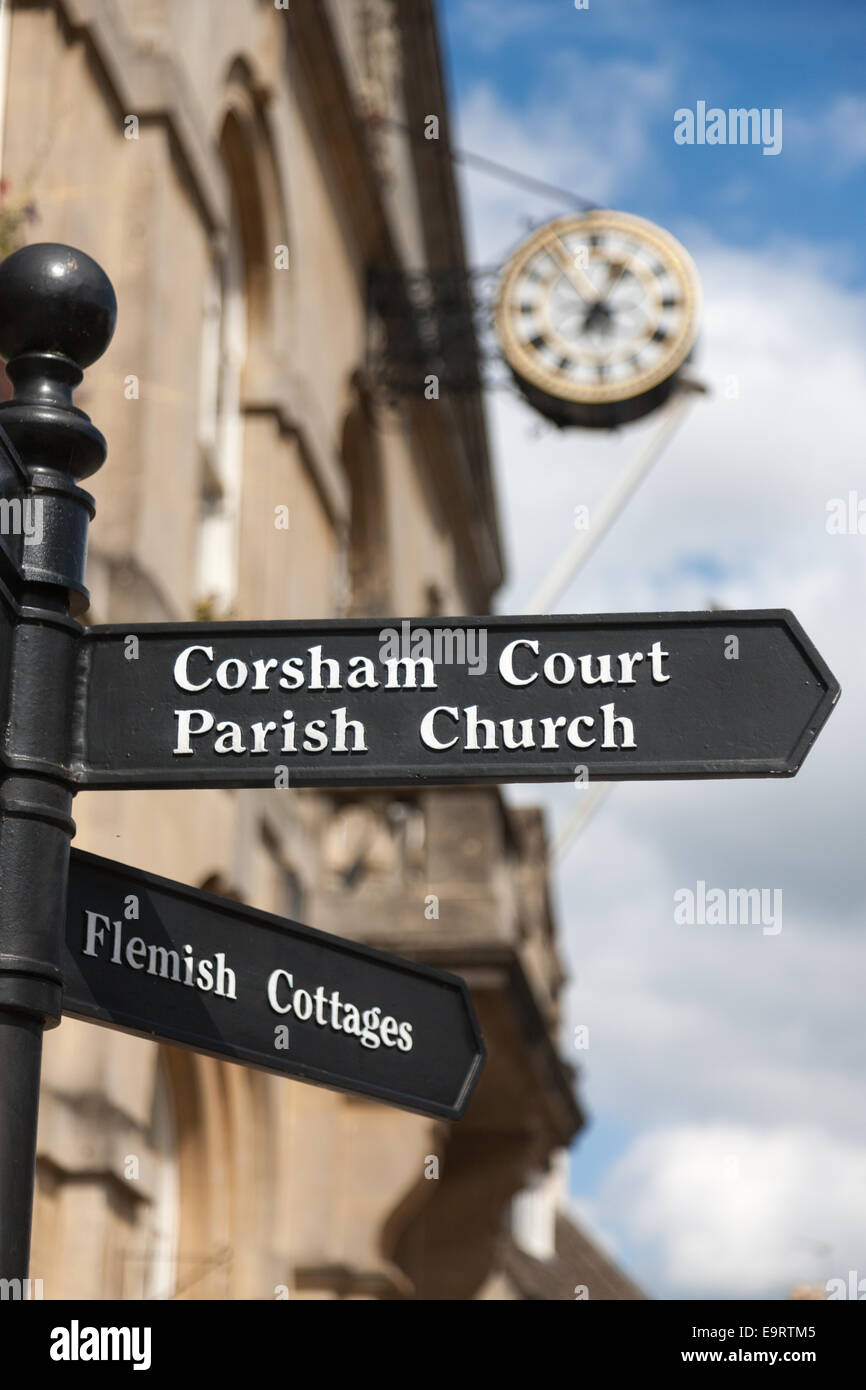 Corsham Town Hall with signposts, flagpoles and clock Stock Photo - Alamy