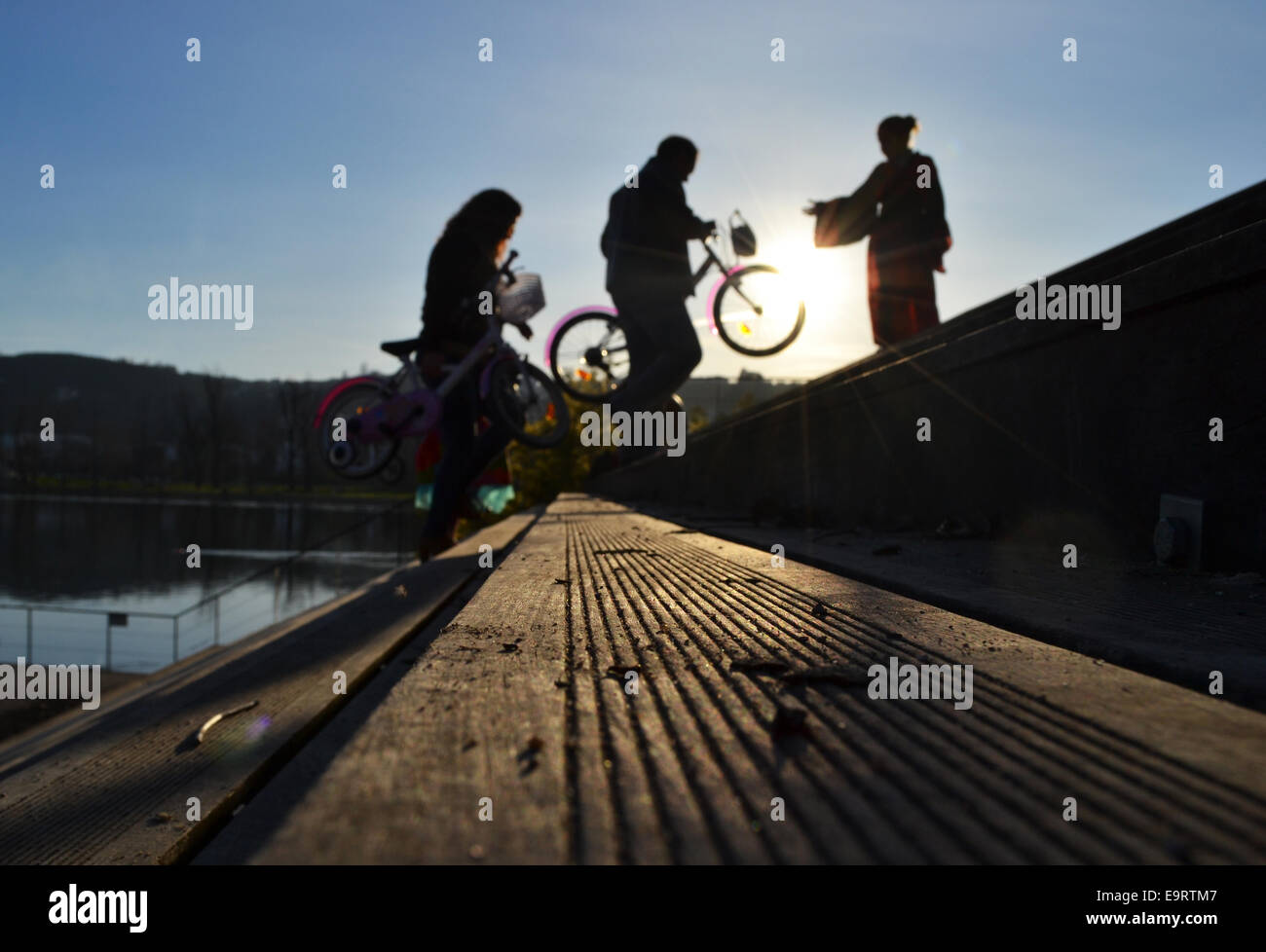 Family climbing stairs at sunset time Stock Photo - Alamy