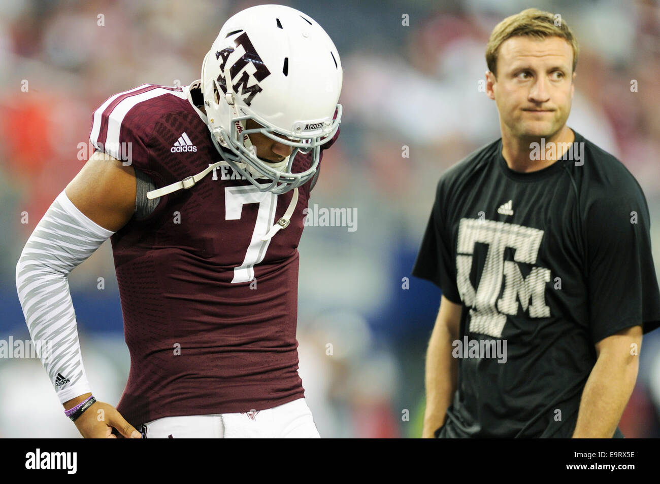 Texas A&M quarterback Kenny Hill (7) with quarterbacks coach Jake ...