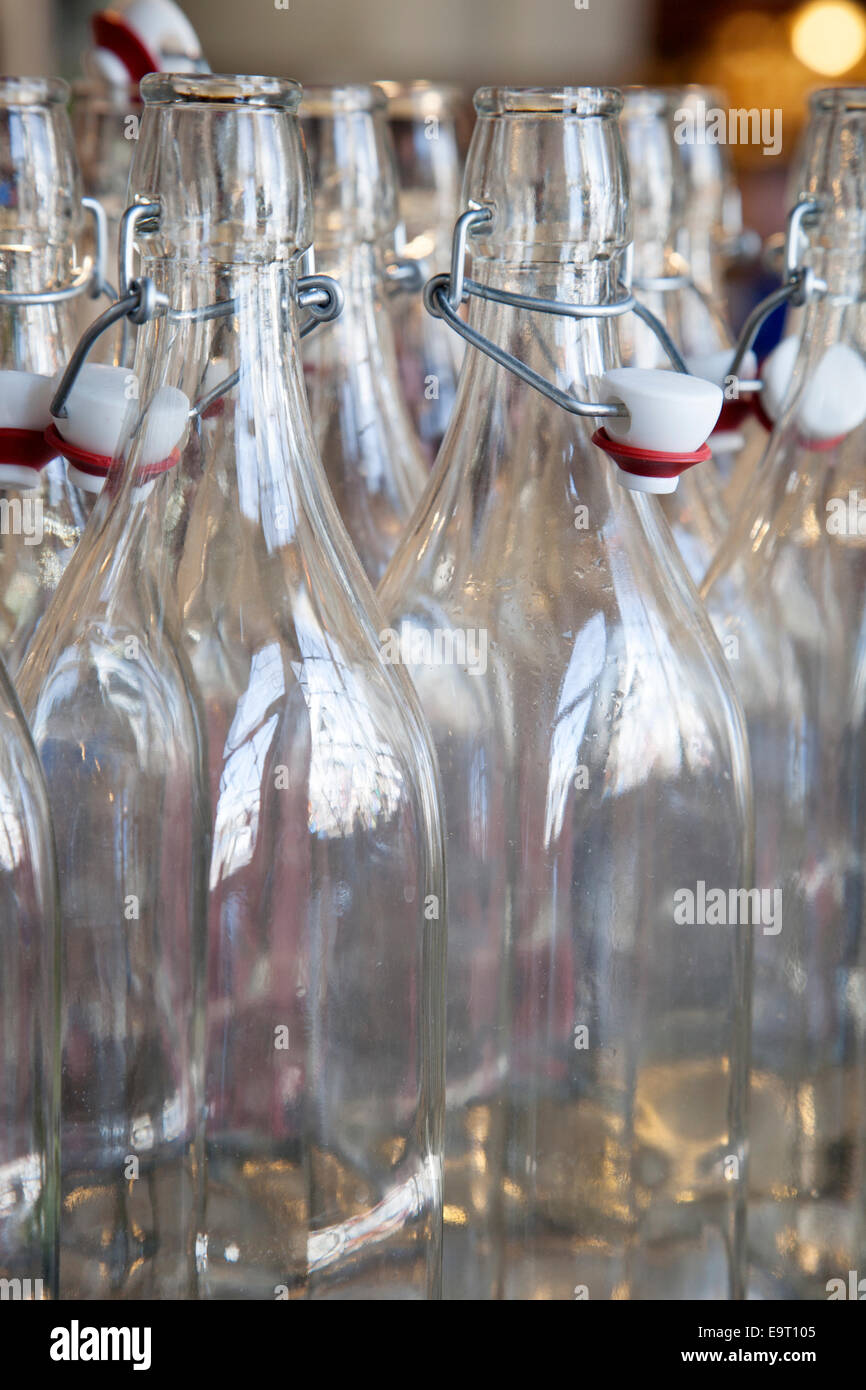 Stacked Glass Bottles in Restaurant Setting Stock Photo - Alamy