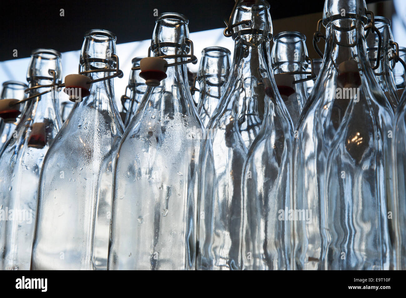 Stacked Glass Bottles in Restaurant Setting Stock Photo - Alamy