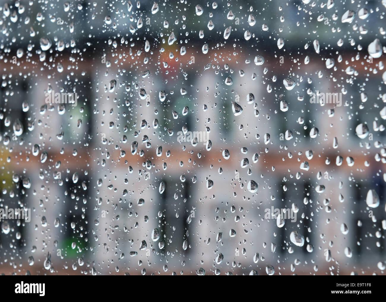 building visible through glass covered by rain drops Stock Photo - Alamy