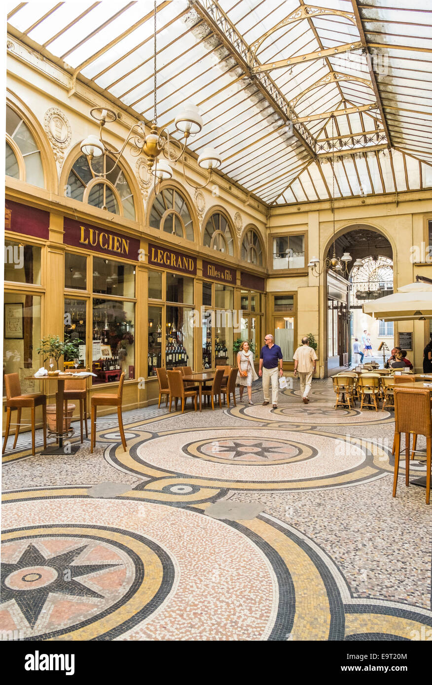 people in front of lucien legrand wine store and restaurant in the ...