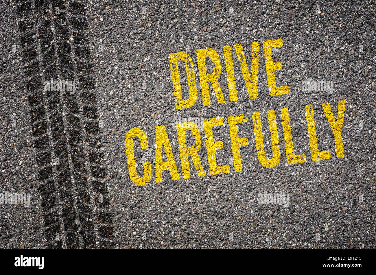 Lane with the text Drive carefully Stock Photo - Alamy