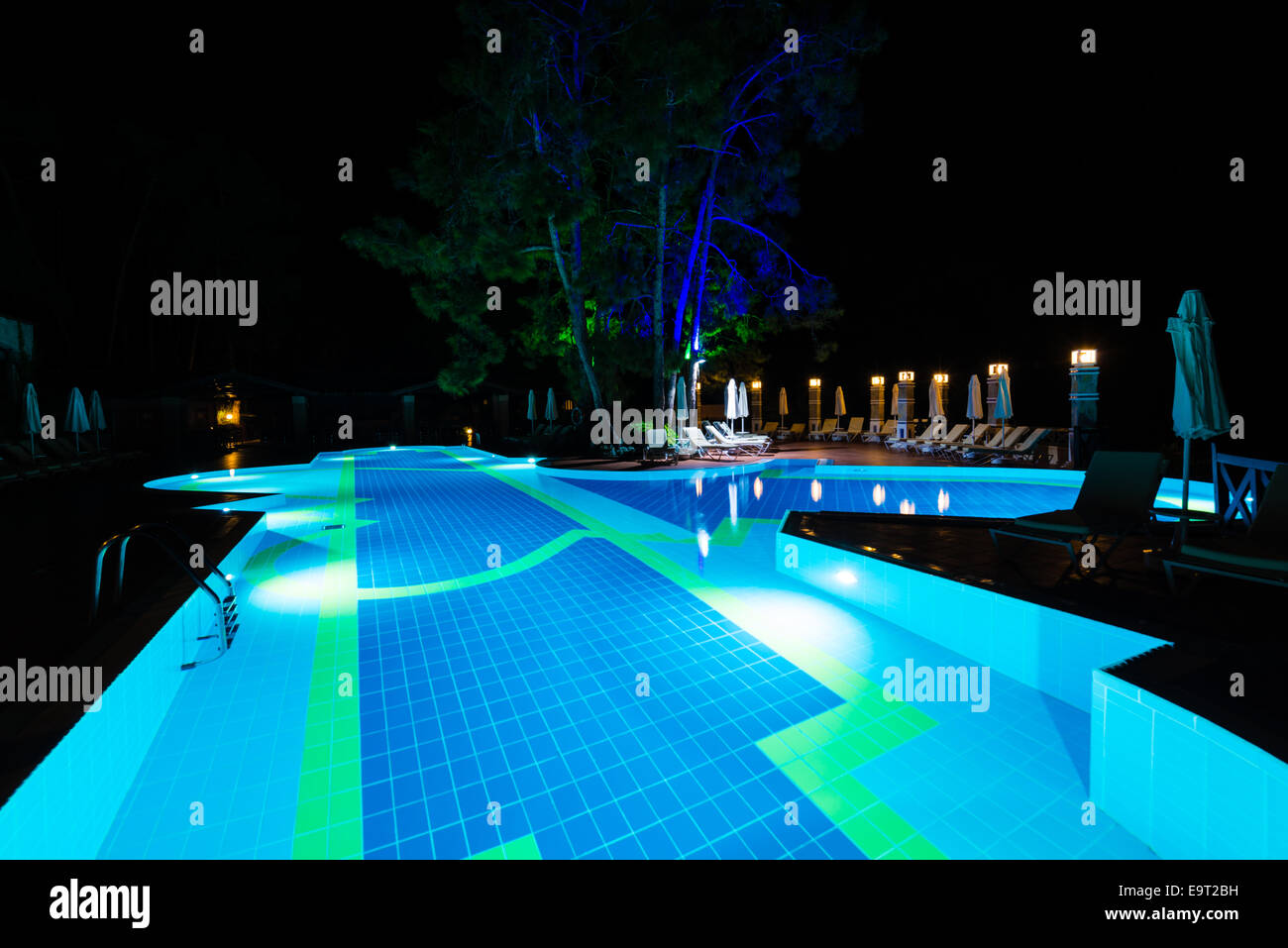 Luxurious tropical resort with gorgeous swimming pool at night Stock ...