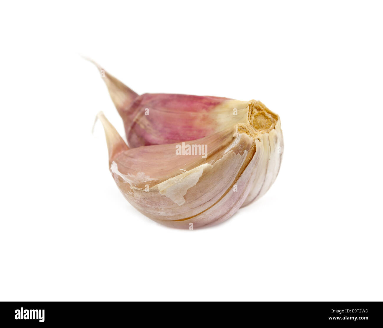 two garlic cloves isolated on white background Stock Photo - Alamy