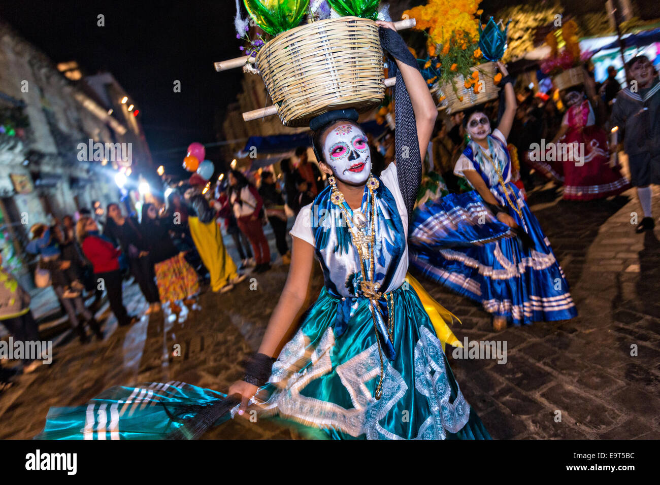 Costumed dancers at a Comparsa, or parade during the Day of the Dead ...