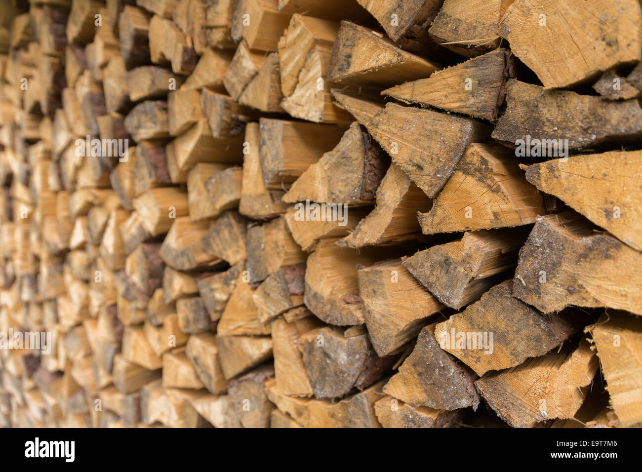Side view of stacked logs prepared for winter Stock Photo - Alamy
