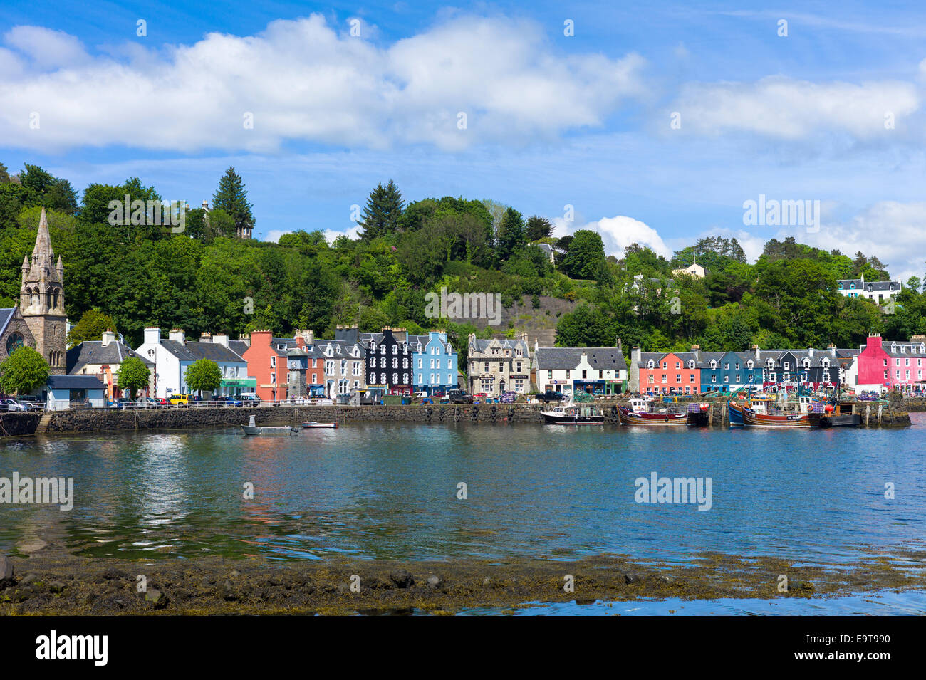 Multi-coloured buildings on the waterfront of Sound of Mull at ...