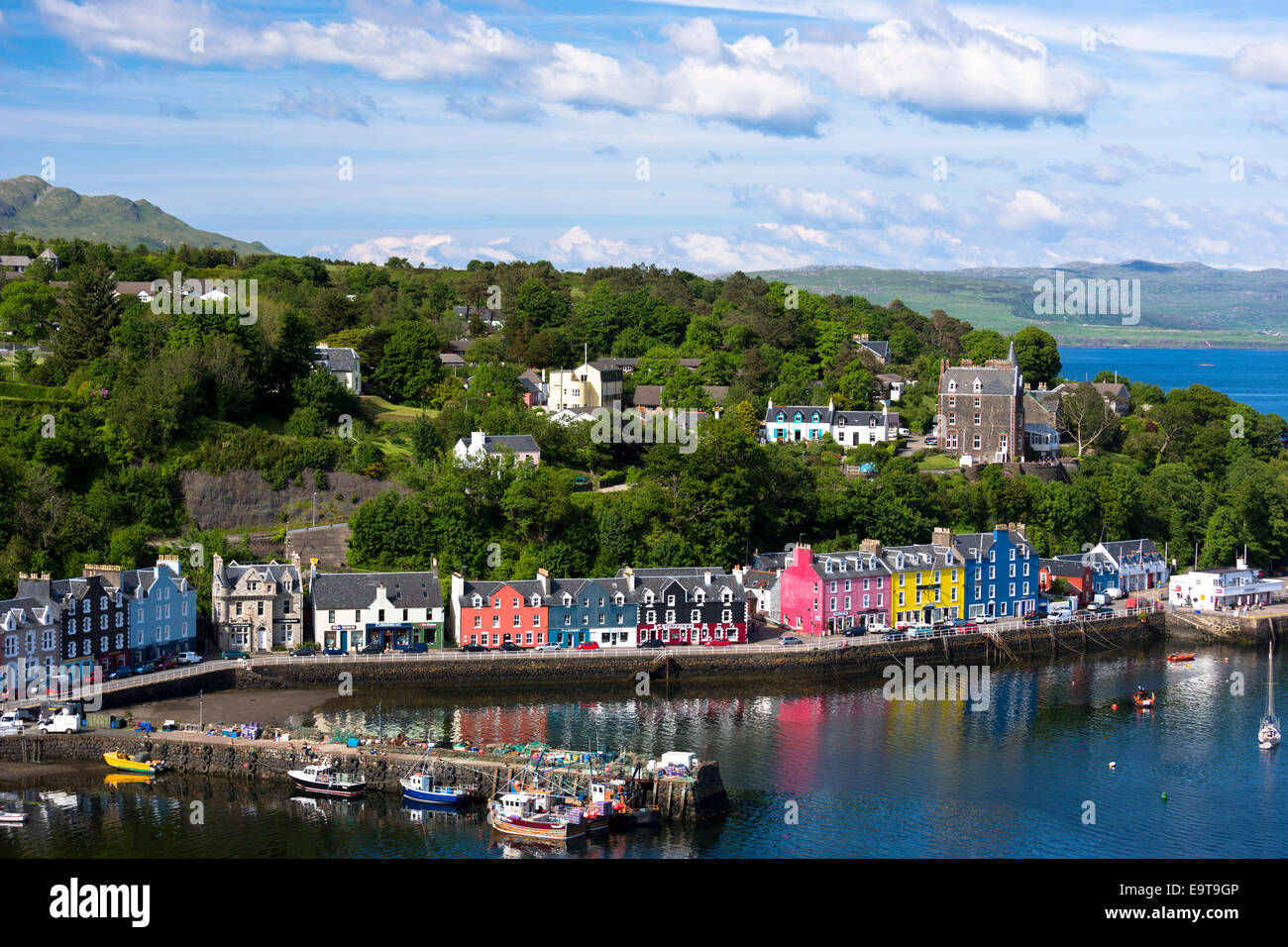 Multi-coloured buildings on the waterfront of Sound of Mull at ...