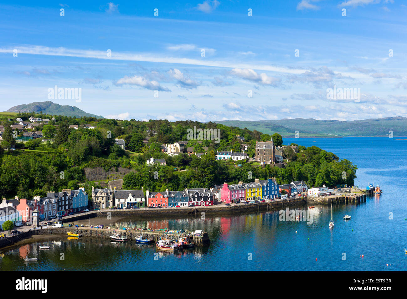 Multi-coloured buildings on the waterfront of Sound of Mull at ...