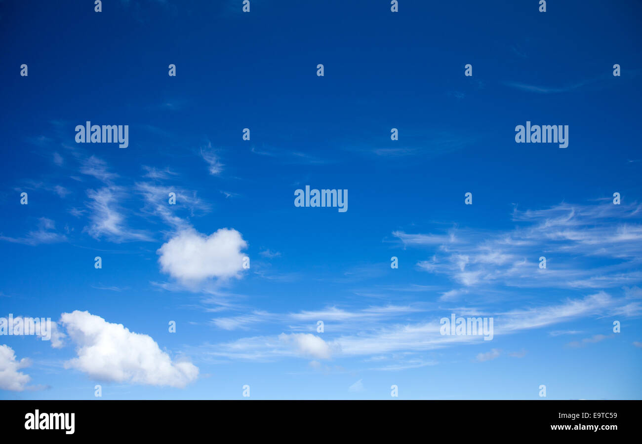 deep blue sky with light clouds background Stock Photo - Alamy