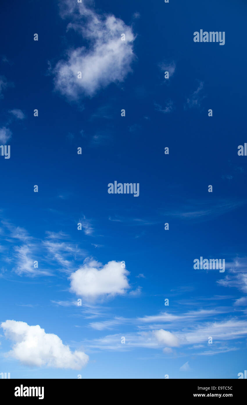 deep blue sky with light clouds background Stock Photo - Alamy