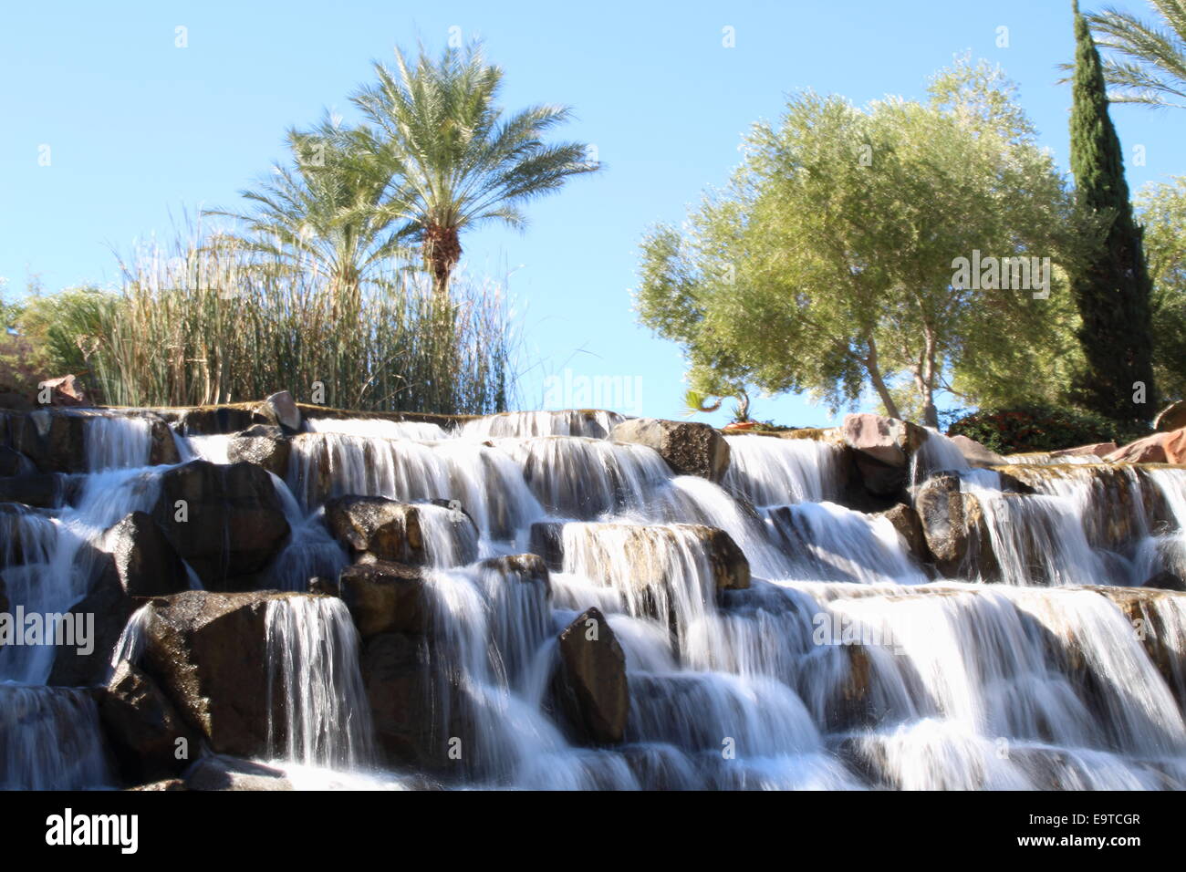 Waterfall Surrounded by palm trees Stock Photo - Alamy