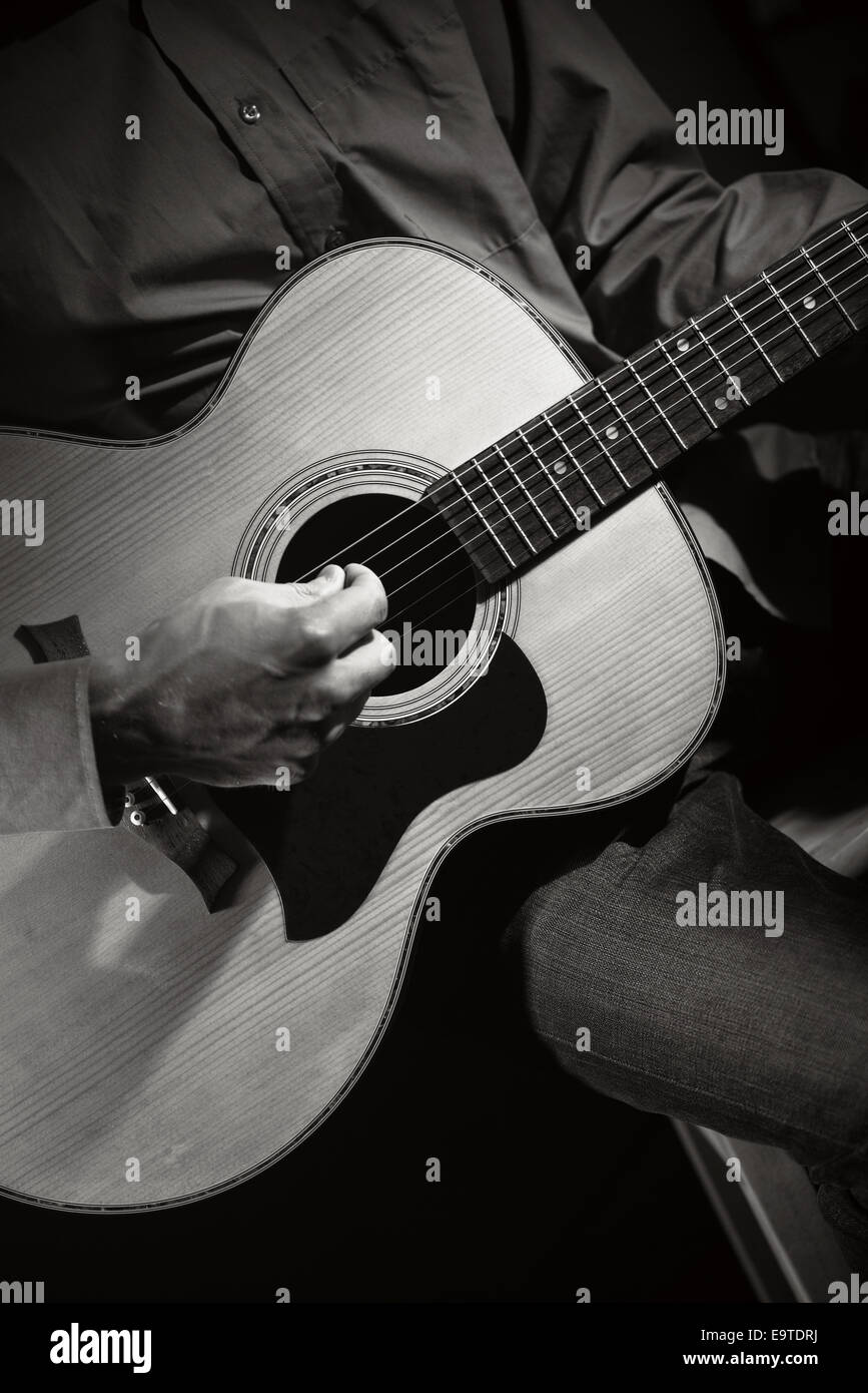 Guitarist playing acoustic guitar. Unplugged performance Stock Photo ...