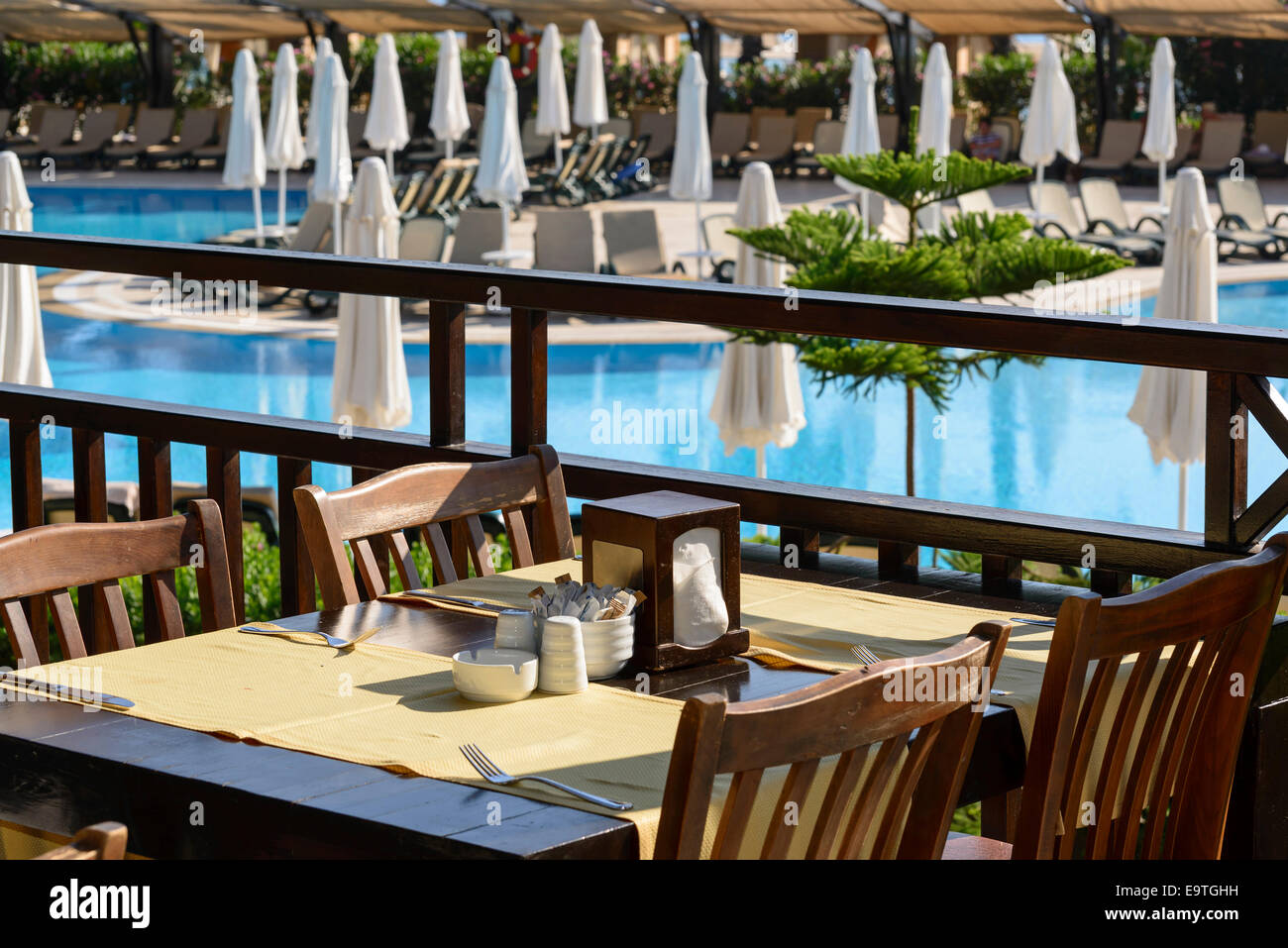 Cosy cafe with beautiful pool Stock Photo - Alamy