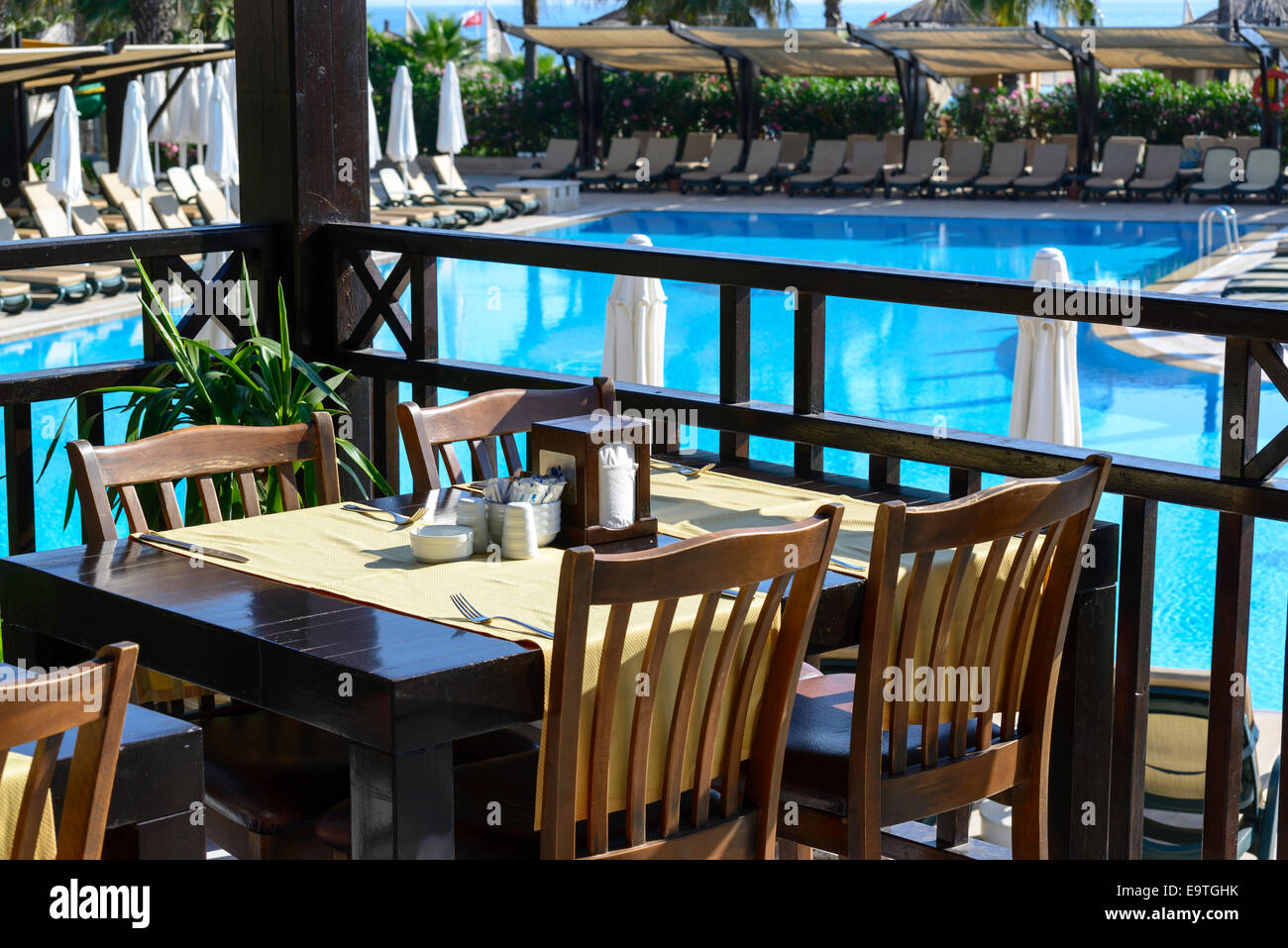 Cosy cafe with beautiful pool Stock Photo - Alamy