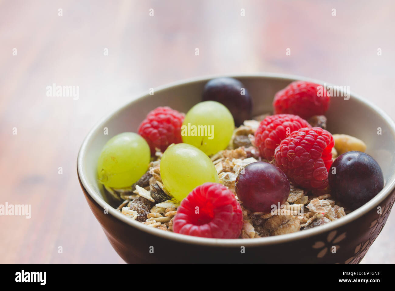 a bowl of muesli with fresh summer fruit Stock Photo - Alamy