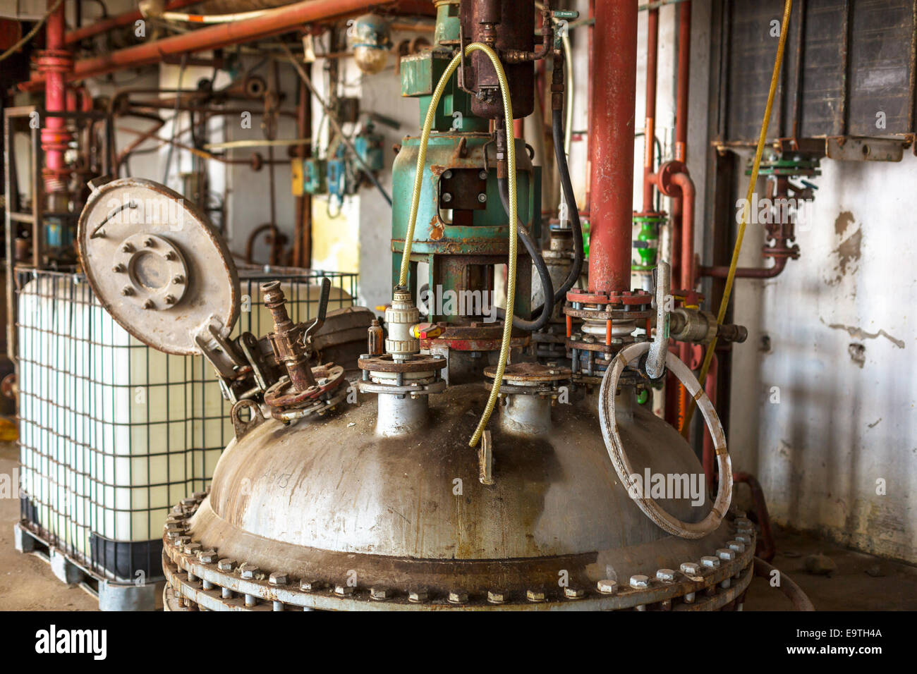 Industrial interior with storage tank Stock Photo - Alamy