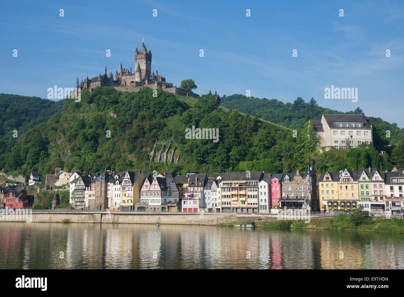 Colourful river front buildings and Reichsburg Castle Cochem Moselle ...