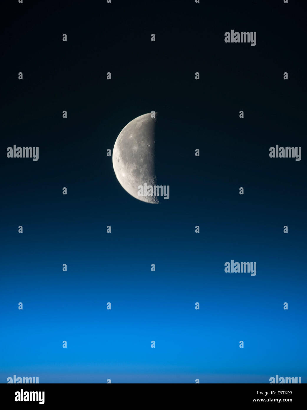 A beautiful depiction of the half moon, showing the illuminated and ...