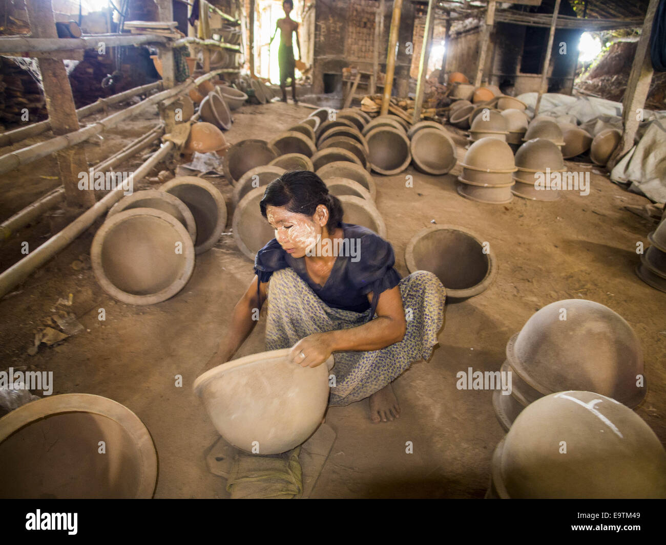 Twante, Yangon Division, Myanmar. 2nd Nov, 2014. A workers polishes the ...