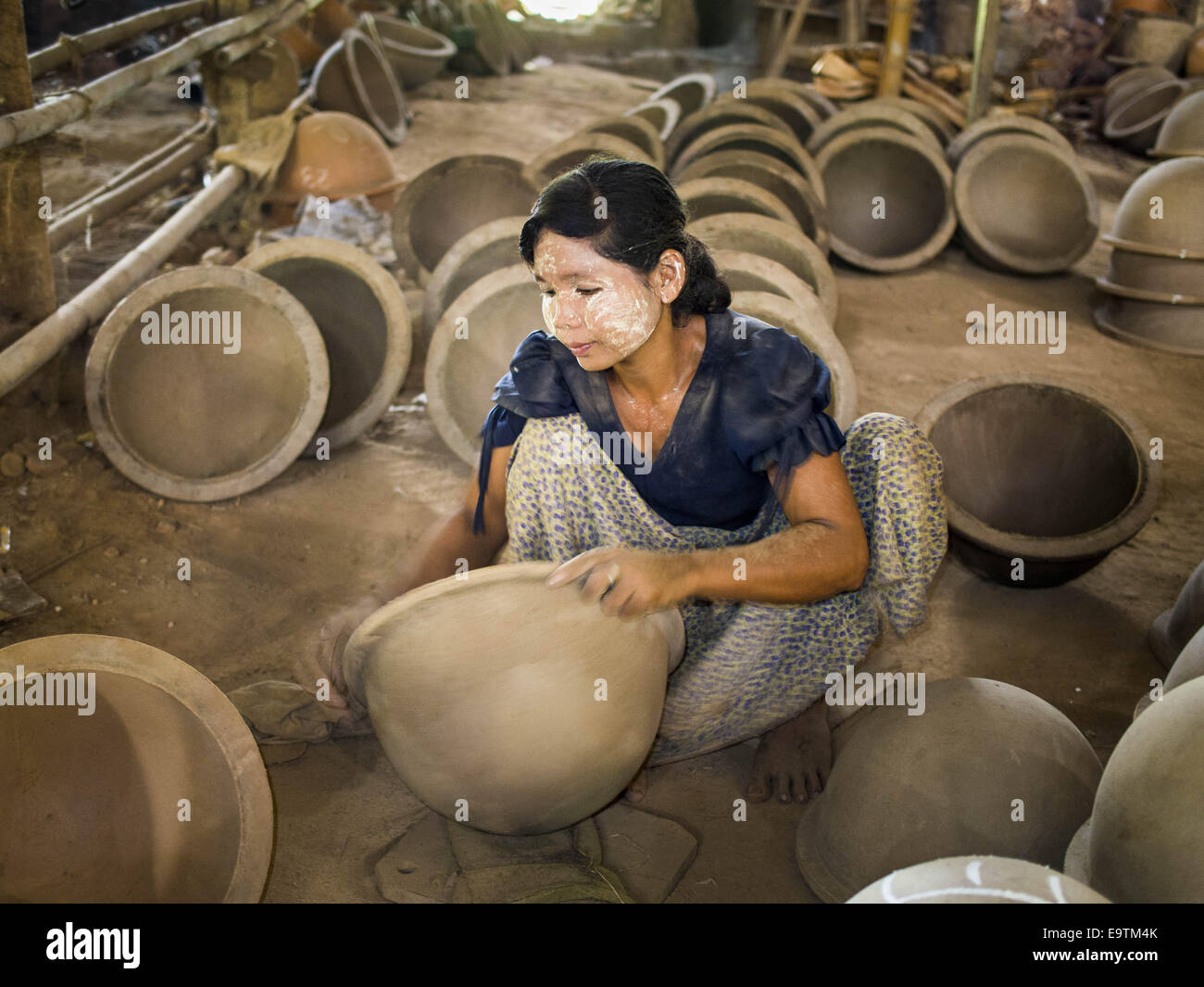 Twante, Yangon Division, Myanmar. 2nd Nov, 2014. A workers polishes the ...