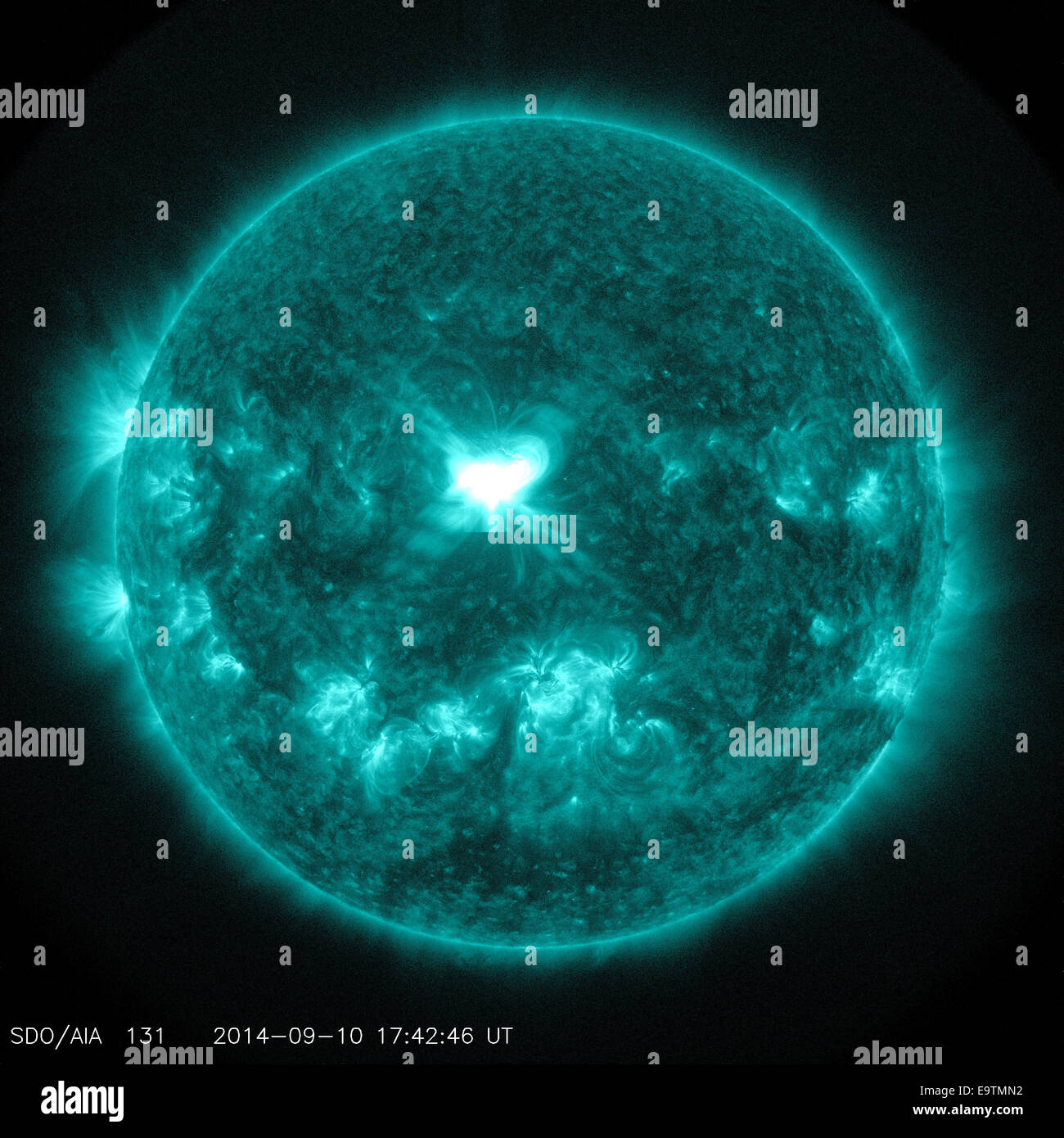 A large solar flare erupts from the Sun's surface, releasing vast ...