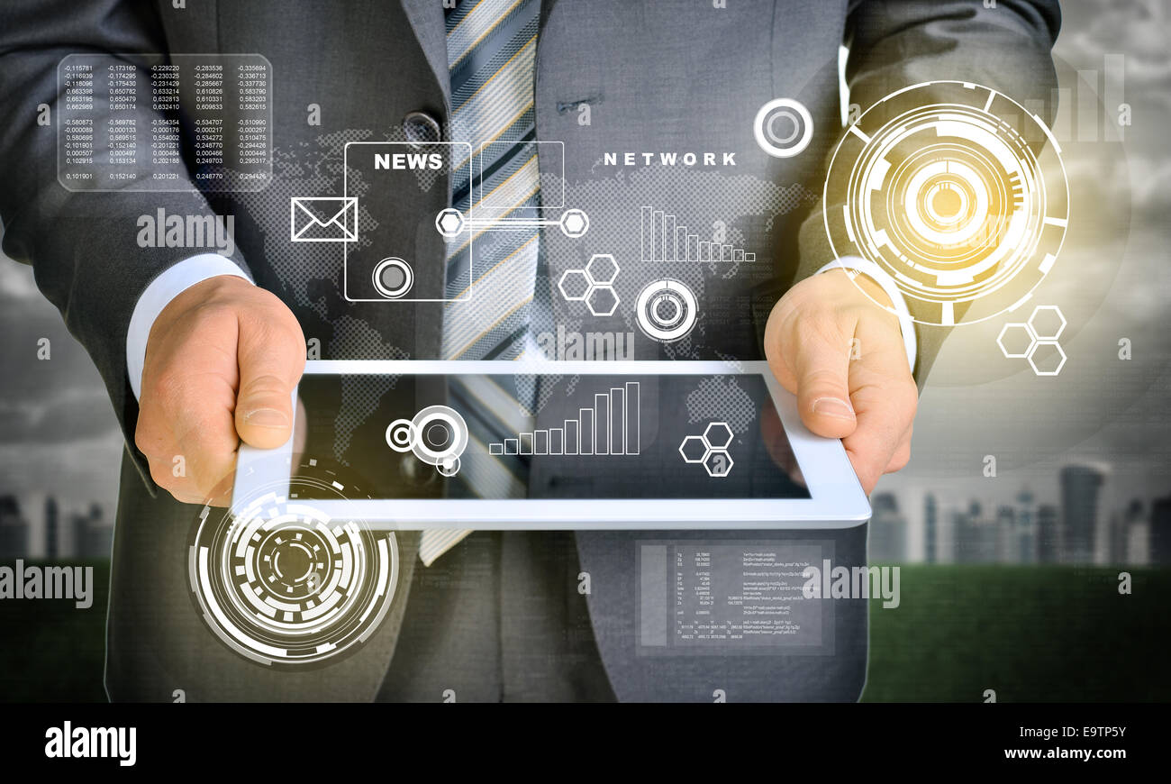 Man hands using tablet. Virtual elements near computer Stock Photo - Alamy