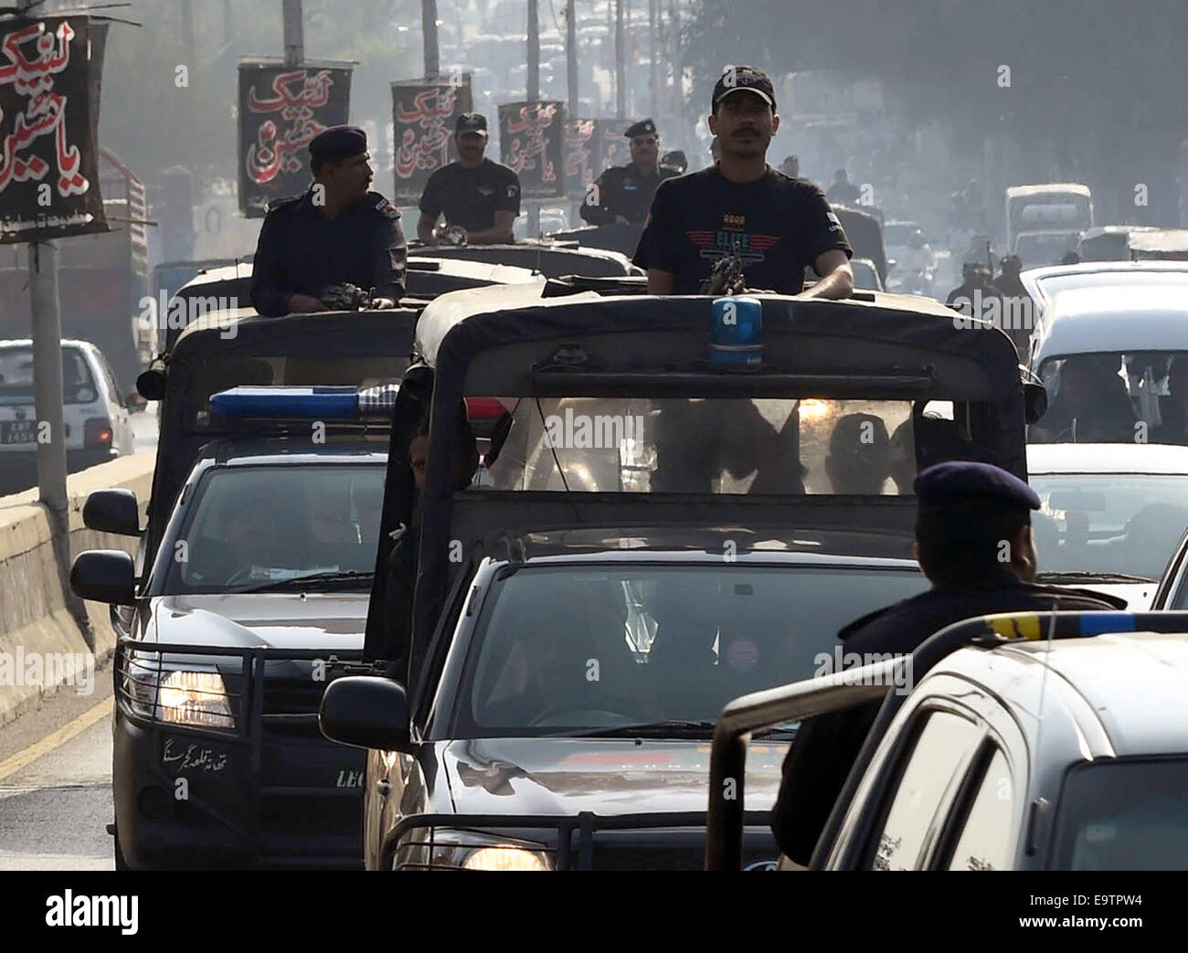 Lahore, Pakistan. 1st Nov, 2014. Pakistani police officers patrol on ...