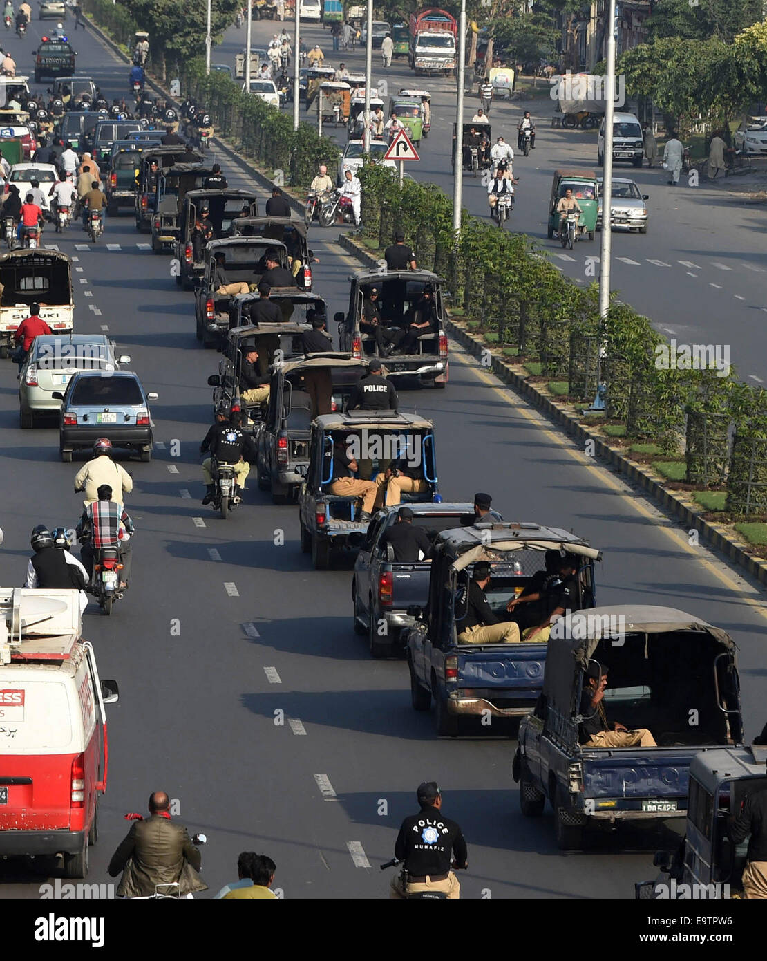 Lahore, Pakistan. 1st Nov, 2014. Pakistani police officers patrol on ...