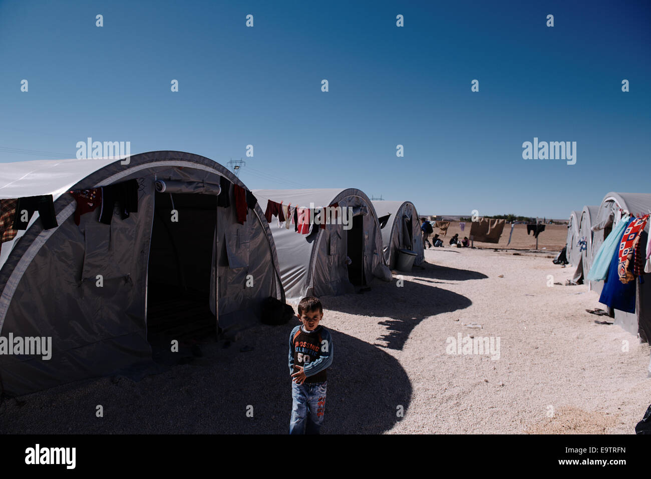 A Kurdish boy inside a Kurdish refugee camp in the border town of Suruc ...