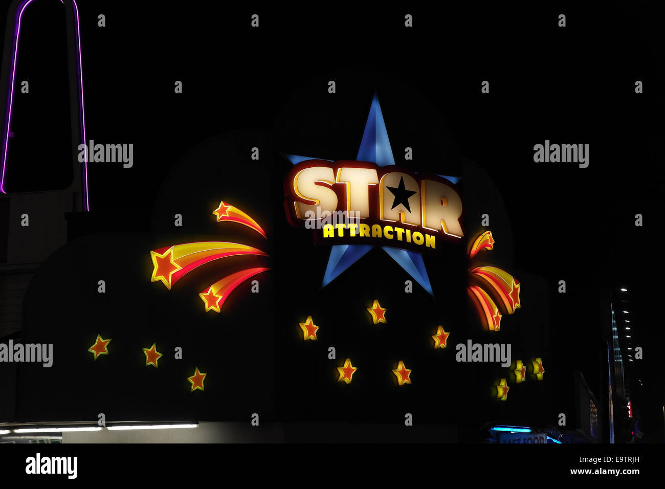 Night view blue red shooting stars sign Star Attraction Amusement ...