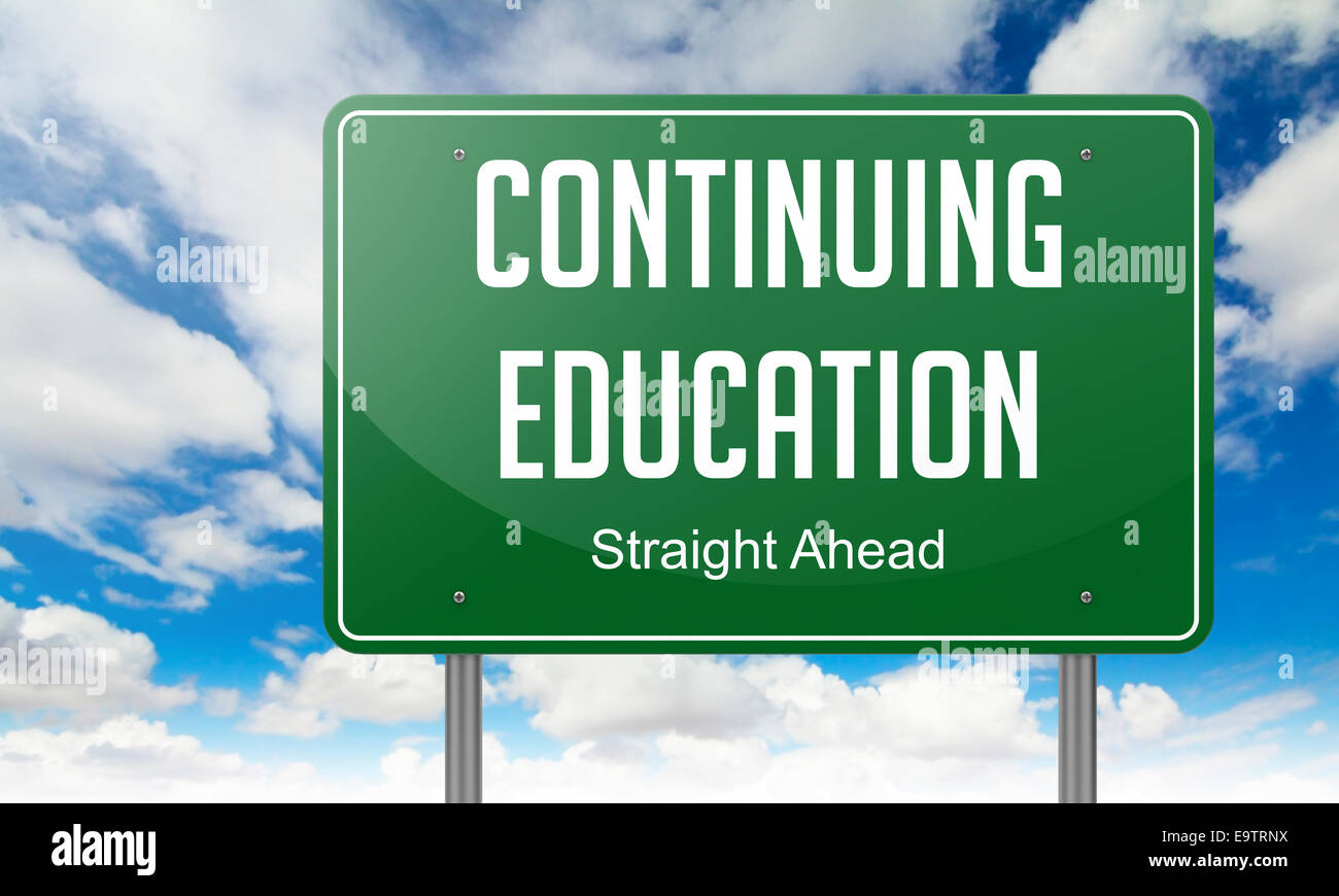 Highway Signpost with Continuing Education wording on Sky Background ...