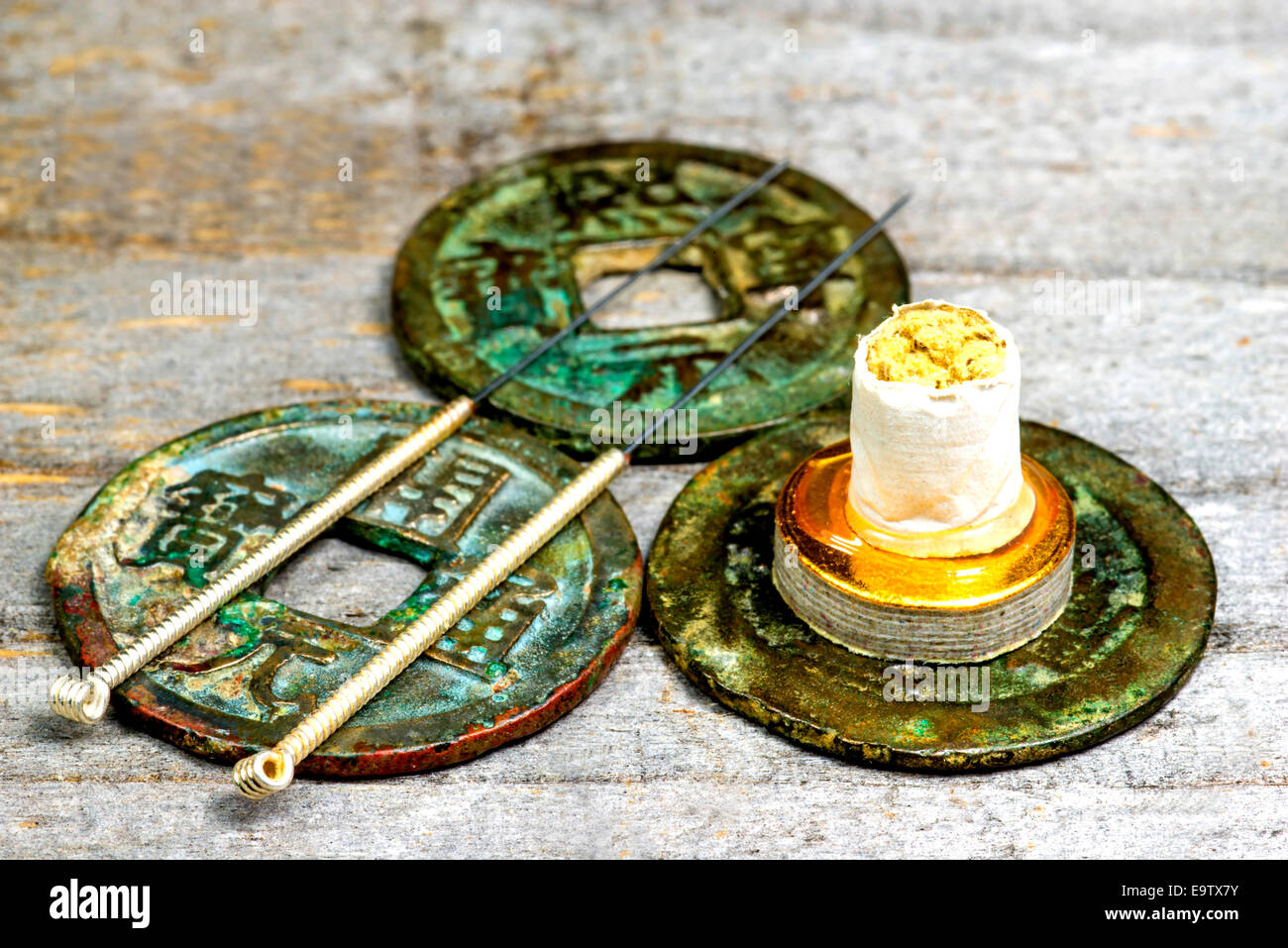 acupunctures needles on antique Chinese coins Stock Photo - Alamy