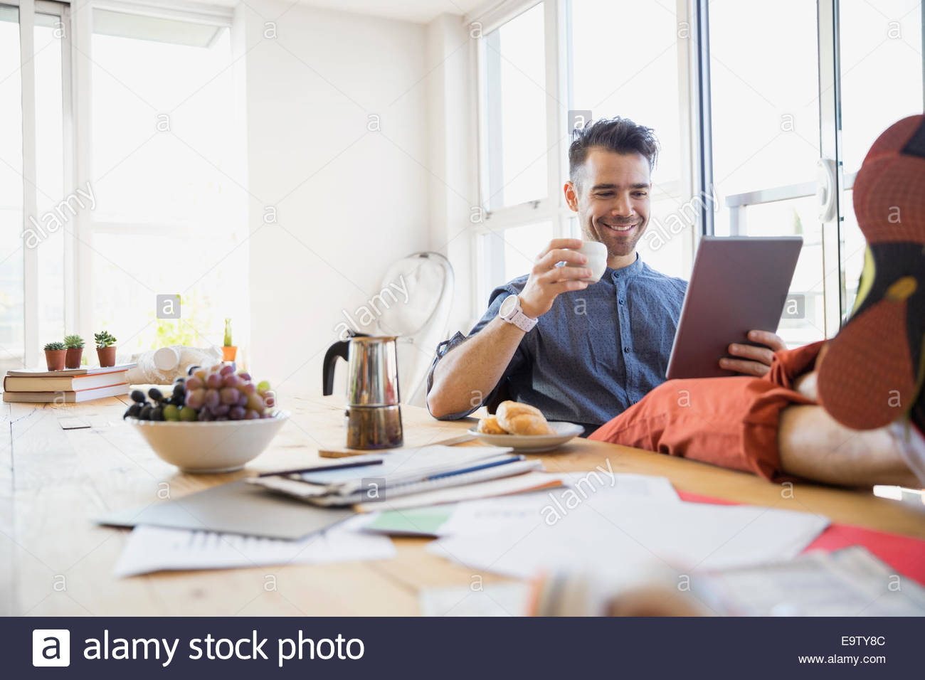 Table sitting feet hi-res stock photography and images - Alamy