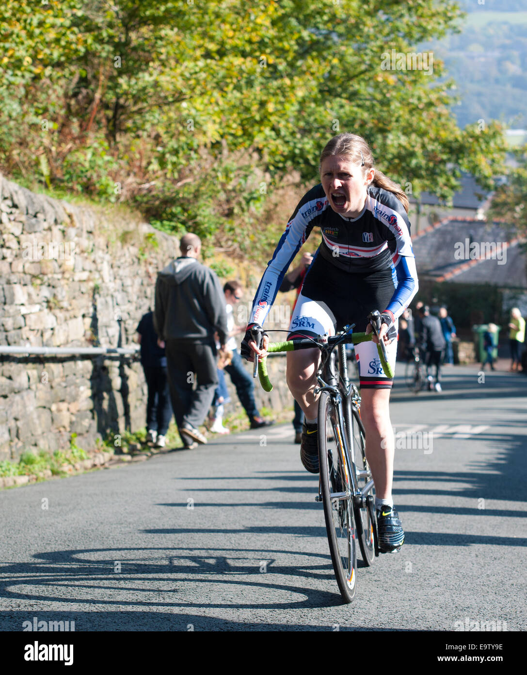Cyclist in hill climbing race in Ramsbottom, Lancashire Stock Photo - Alamy