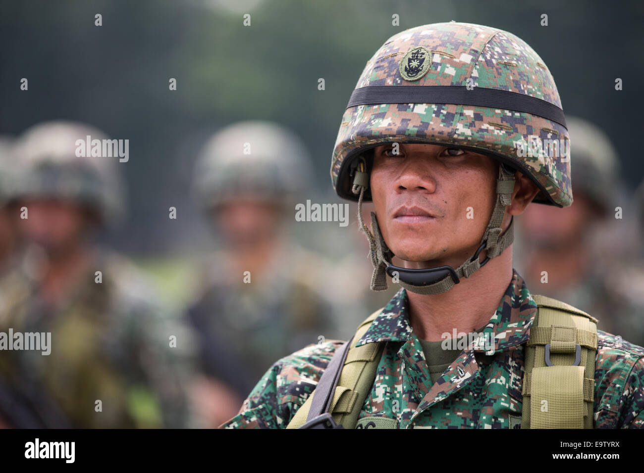 A Philippine marine stands in formation Oct. 10, 2014, during the ...
