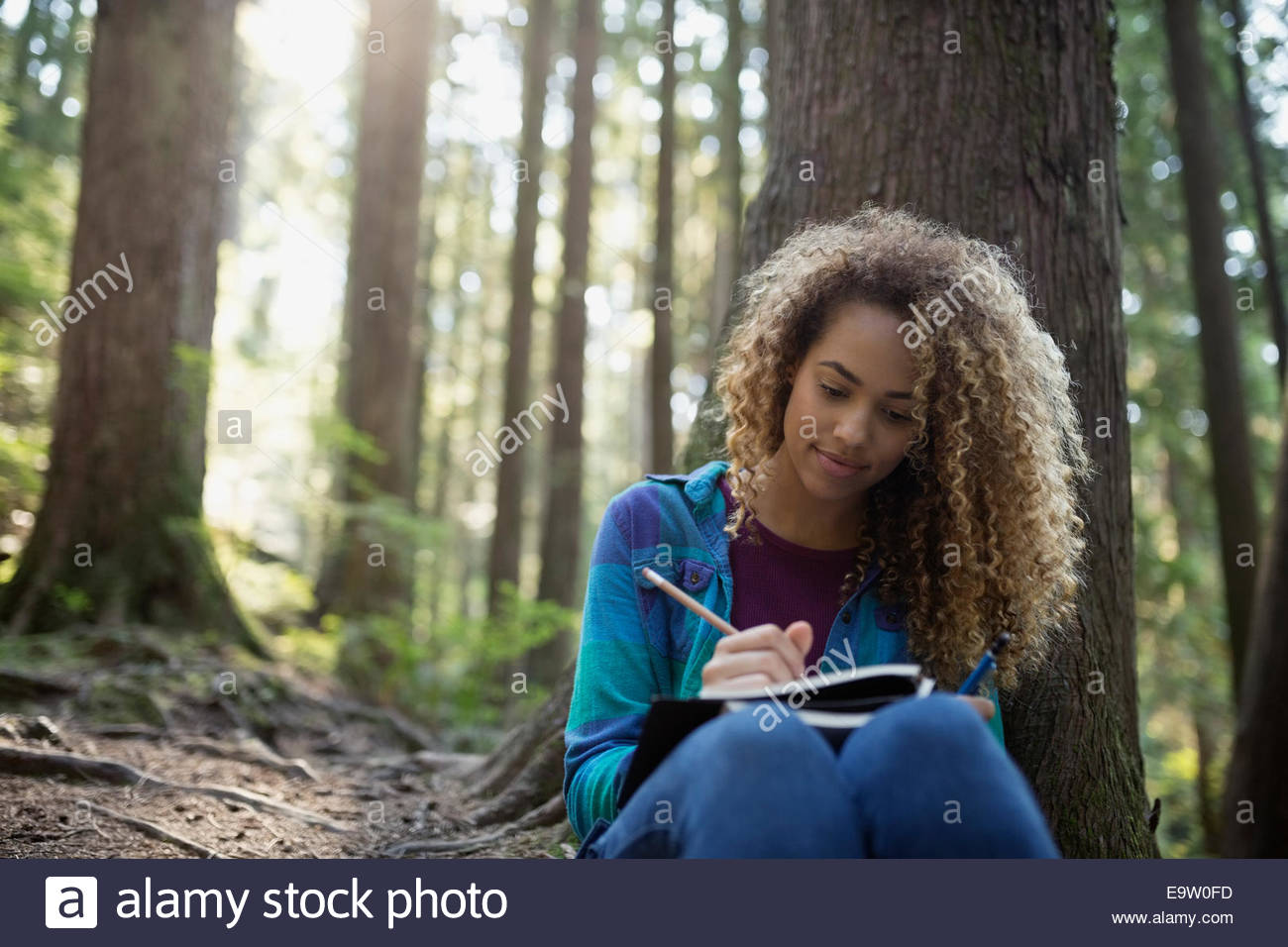Woman writing hi-res stock photography and images - Alamy