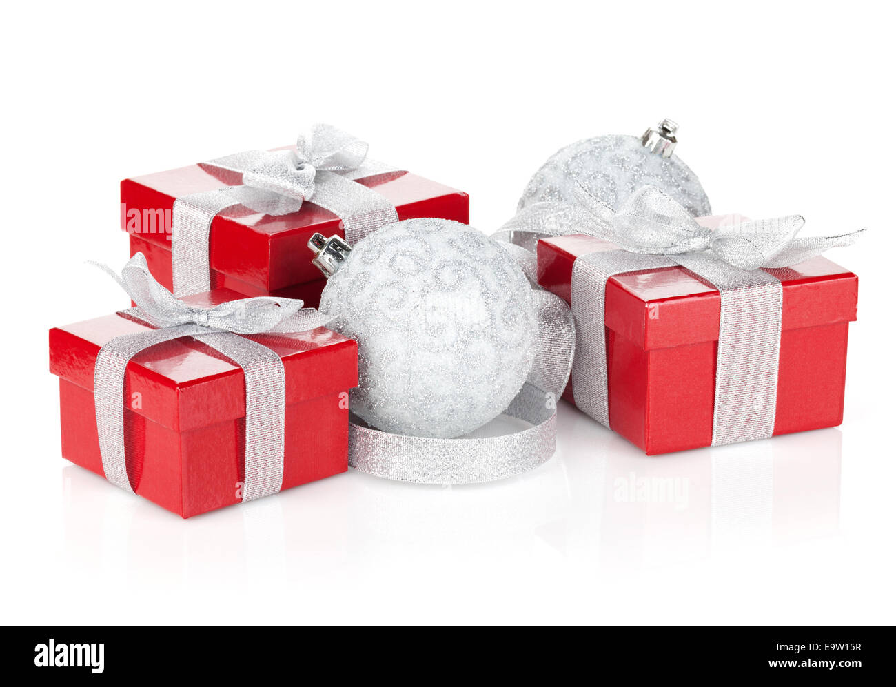 Three christmas gift boxes with baubles. Isolated on white background ...