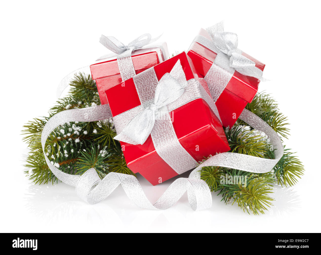 Three christmas gift boxes with fir tree. Isolated on white background ...