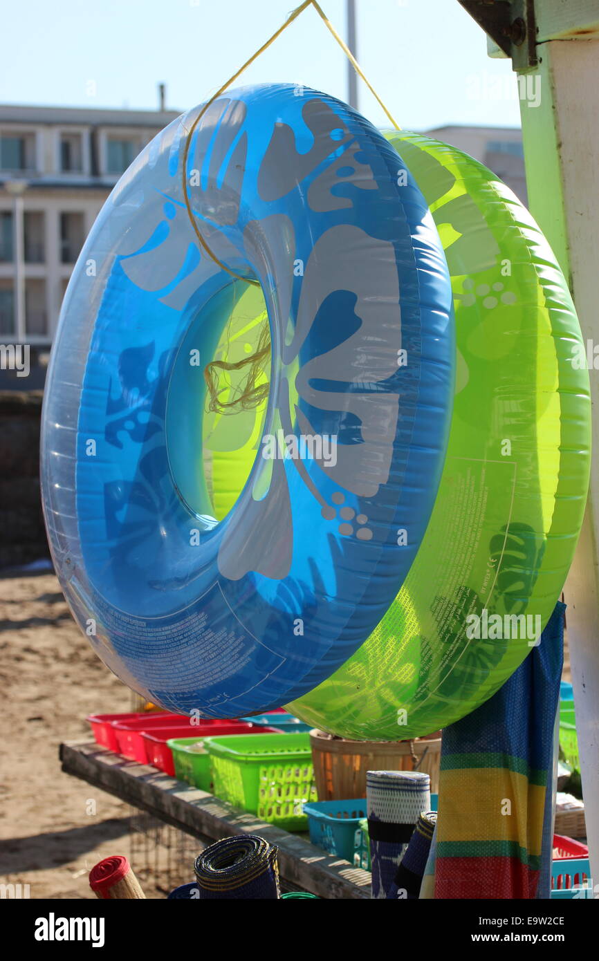 inflatable swimming rings on the beach Stock Photo - Alamy